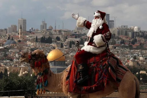 This Santa rides a camel around Jerusalem every year. Here’s why ...